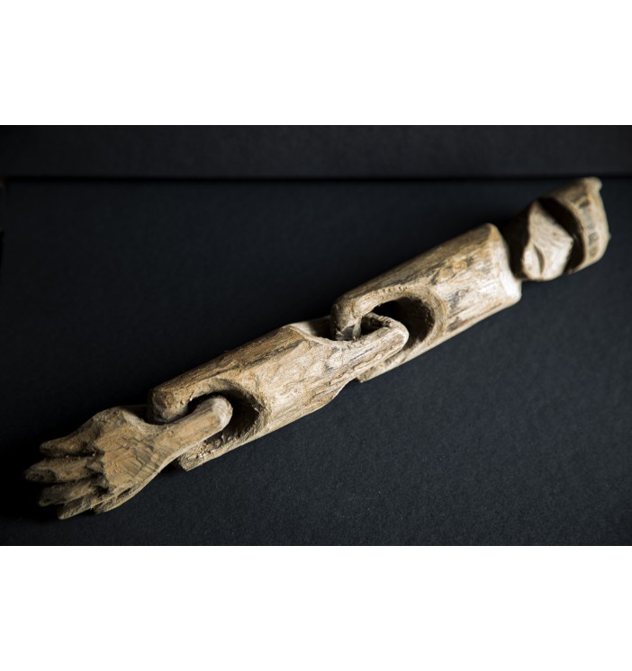 Shaman's helper idol with a bear's head and paw. Ritual wooden art.