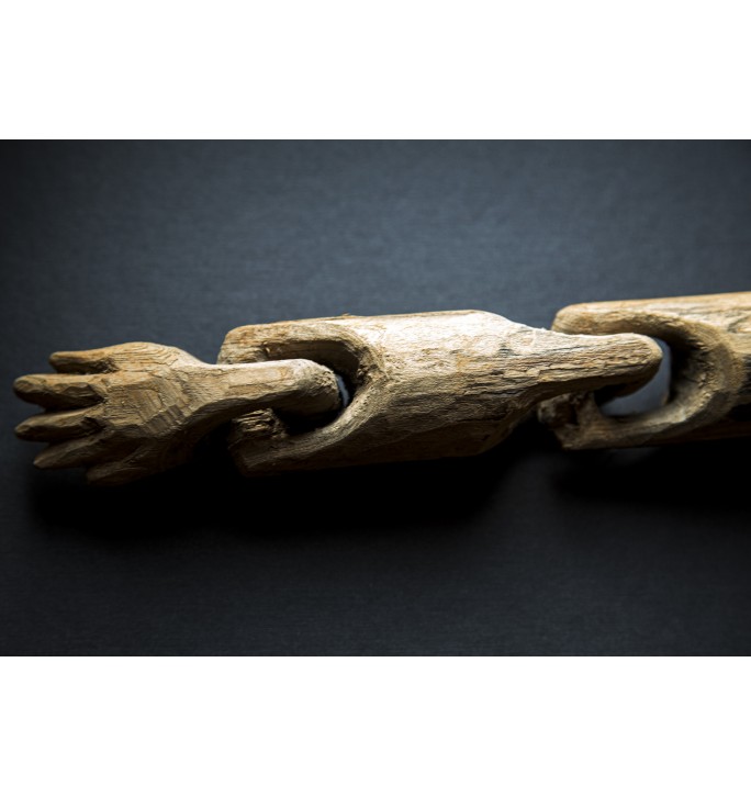 Shaman's helper idol with a bear's head and paw. Ritual wooden art.