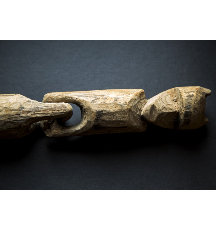 Shaman's helper idol with a bear's head and paw. Ritual wooden art.